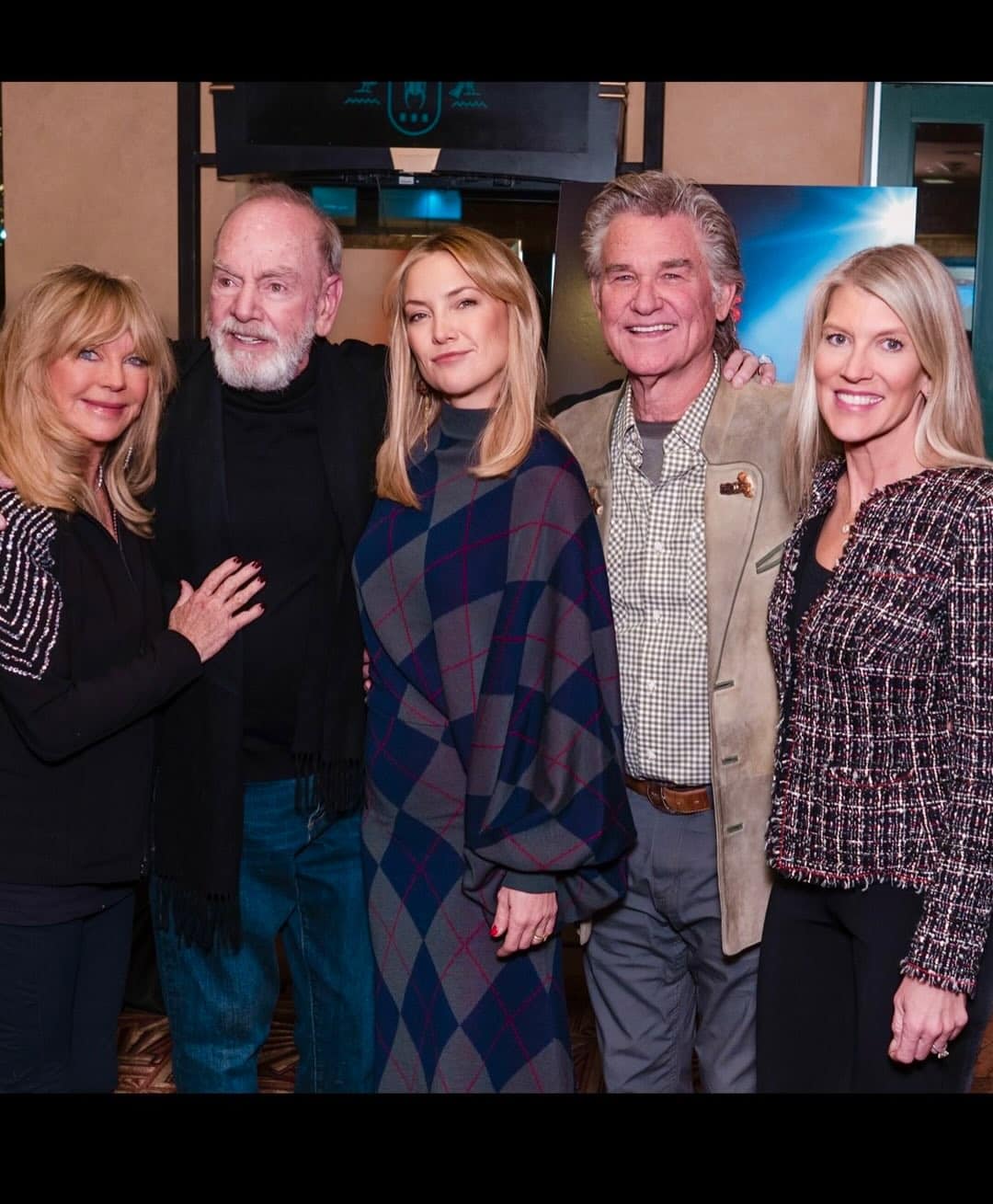 Beneath the soft theater lights, Goldie Hawn and Neil Diamond shared a ...